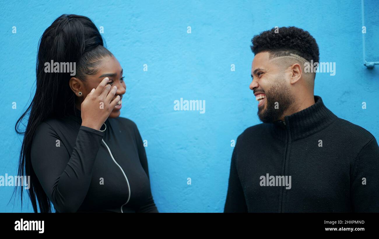 Two friends laughing and smiling hanging out together Stock Photo - Alamy