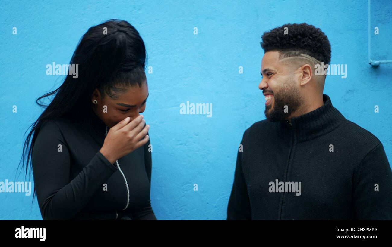 Two friends laughing and smiling hanging out together Stock Photo - Alamy