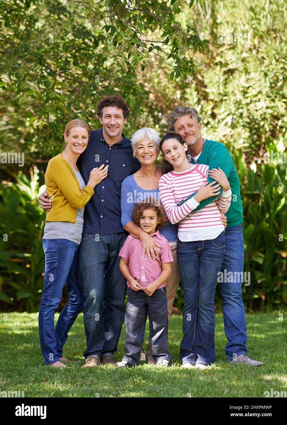 Family always comes first. Shot of a family posing for a photo Stock ...