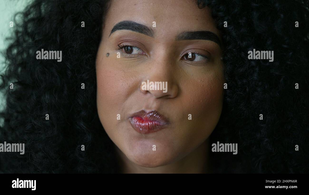 A doubtful black woman face closeup a thoughtful African person Stock ...