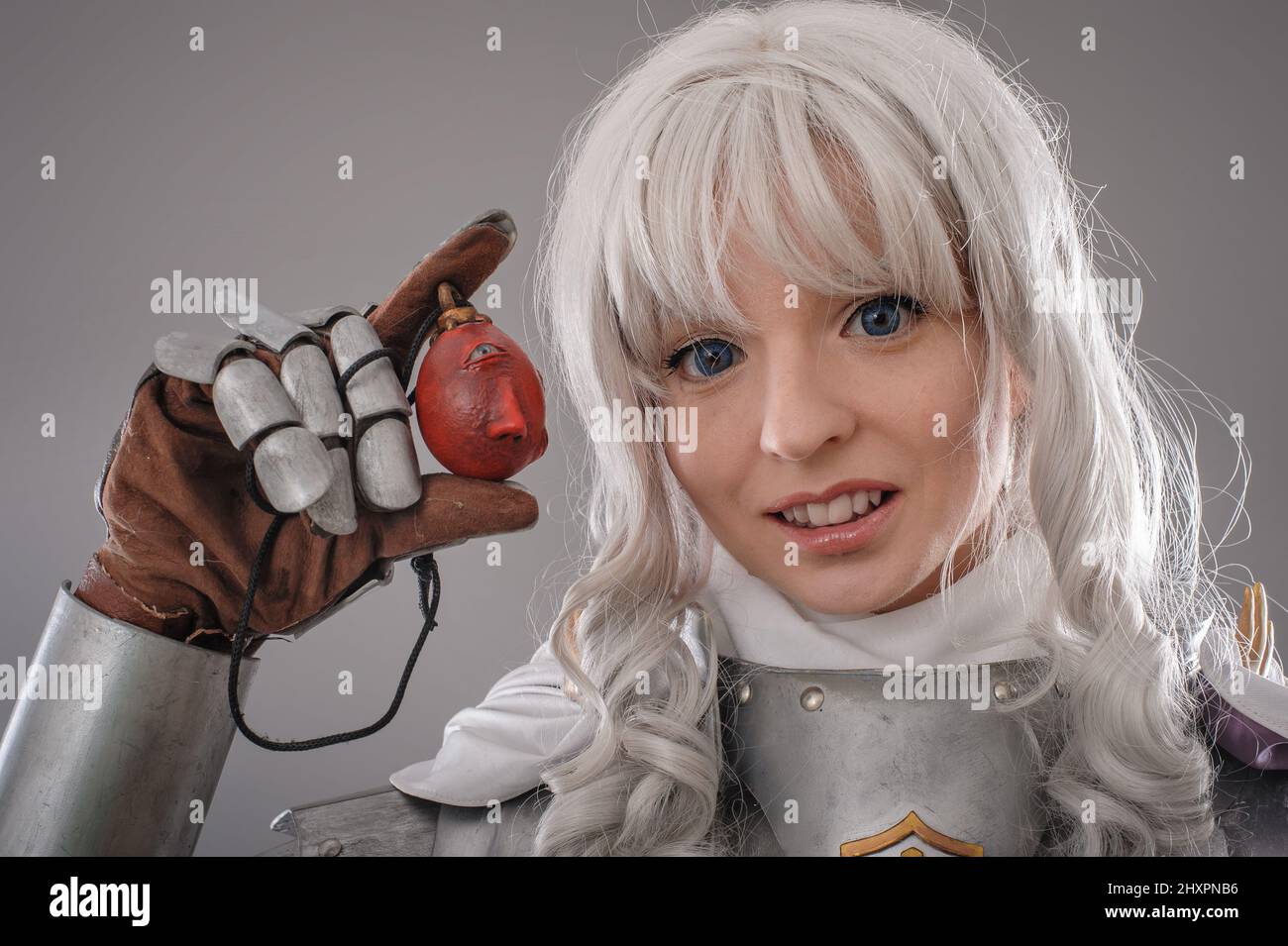 Female Knight In Shining Armour with sword isolated on the gray ...
