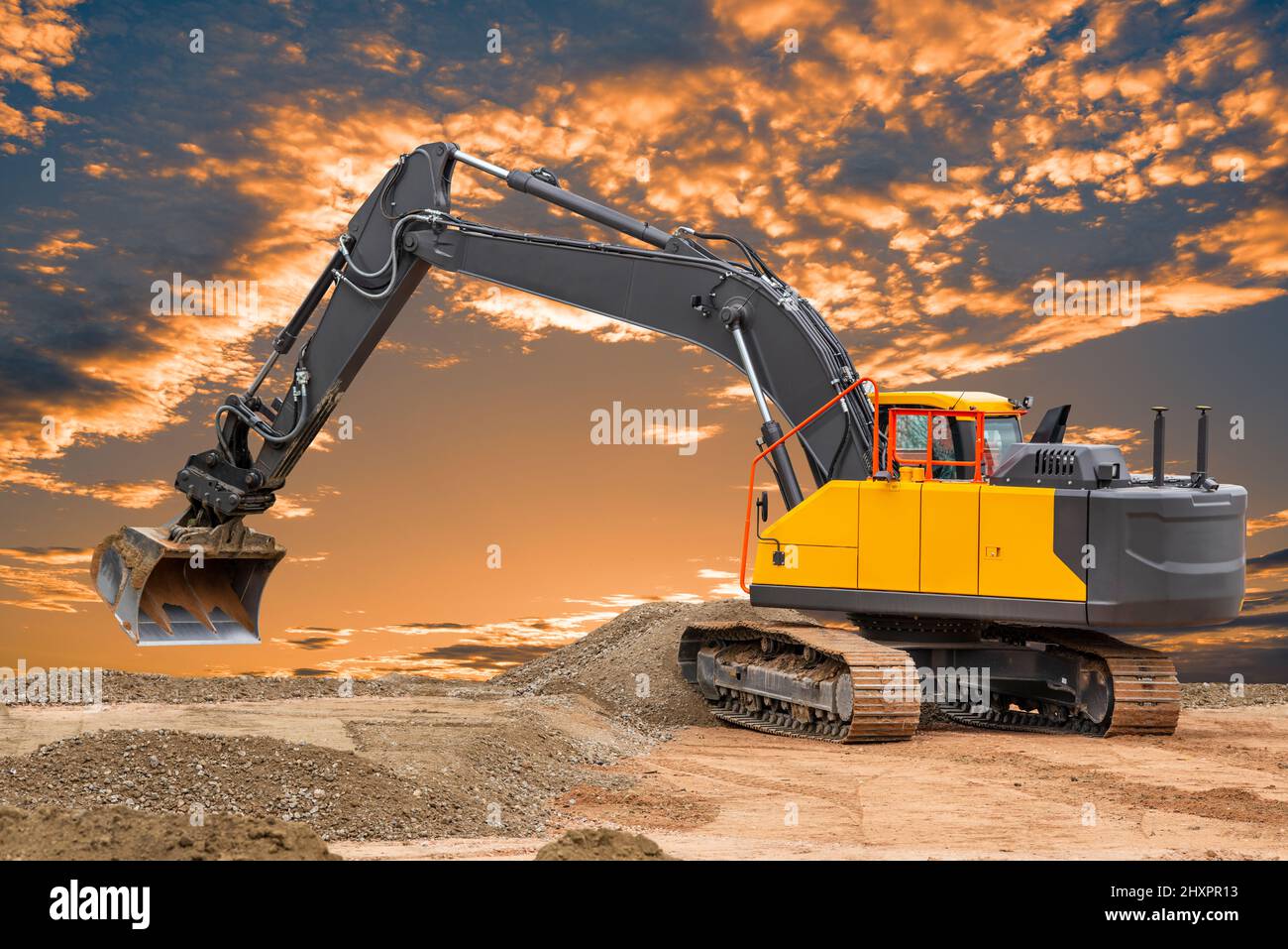 earth mover and excavator at work in construction site Stock Photo - Alamy