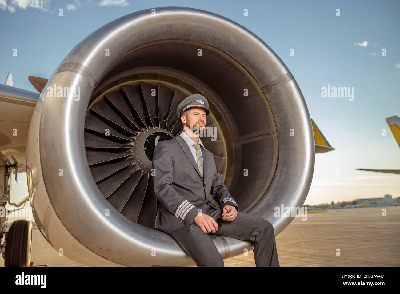 Airline captain sitting in airplane engine at airport Stock Photo - Alamy