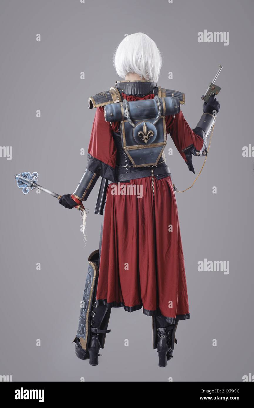 Woman warrior in battle armor. Isolated on the gray background Stock ...