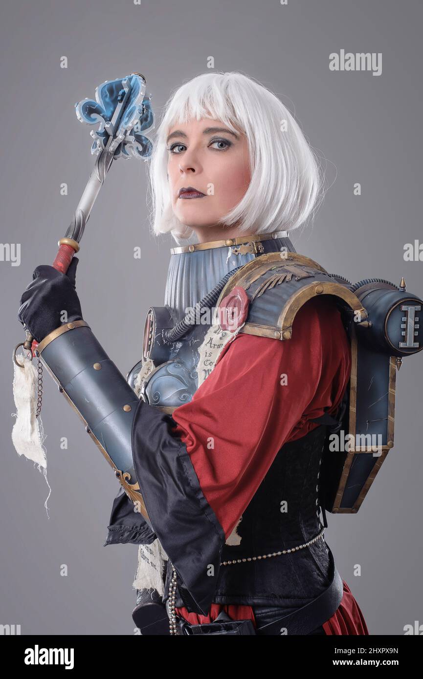 Woman warrior in battle armor. Isolated on the gray background Stock ...