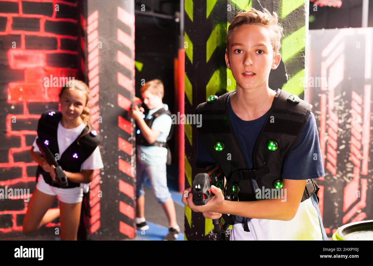 Boy having fun on lasertag arena Stock Photo - Alamy