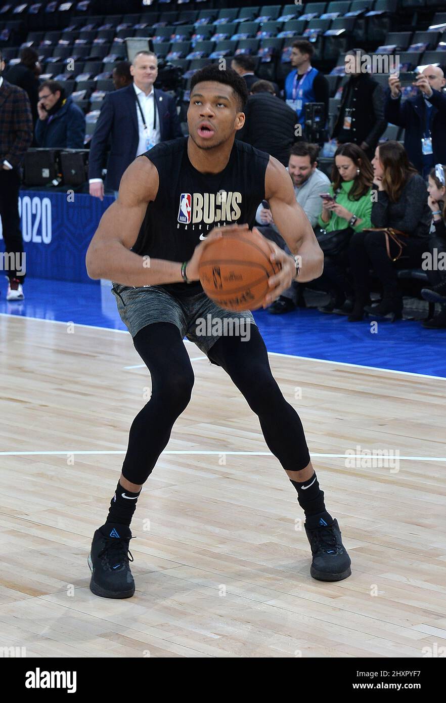 Giannis Antetokounmpo #34 and teammate of the Milwaukee Bucks shoots ...