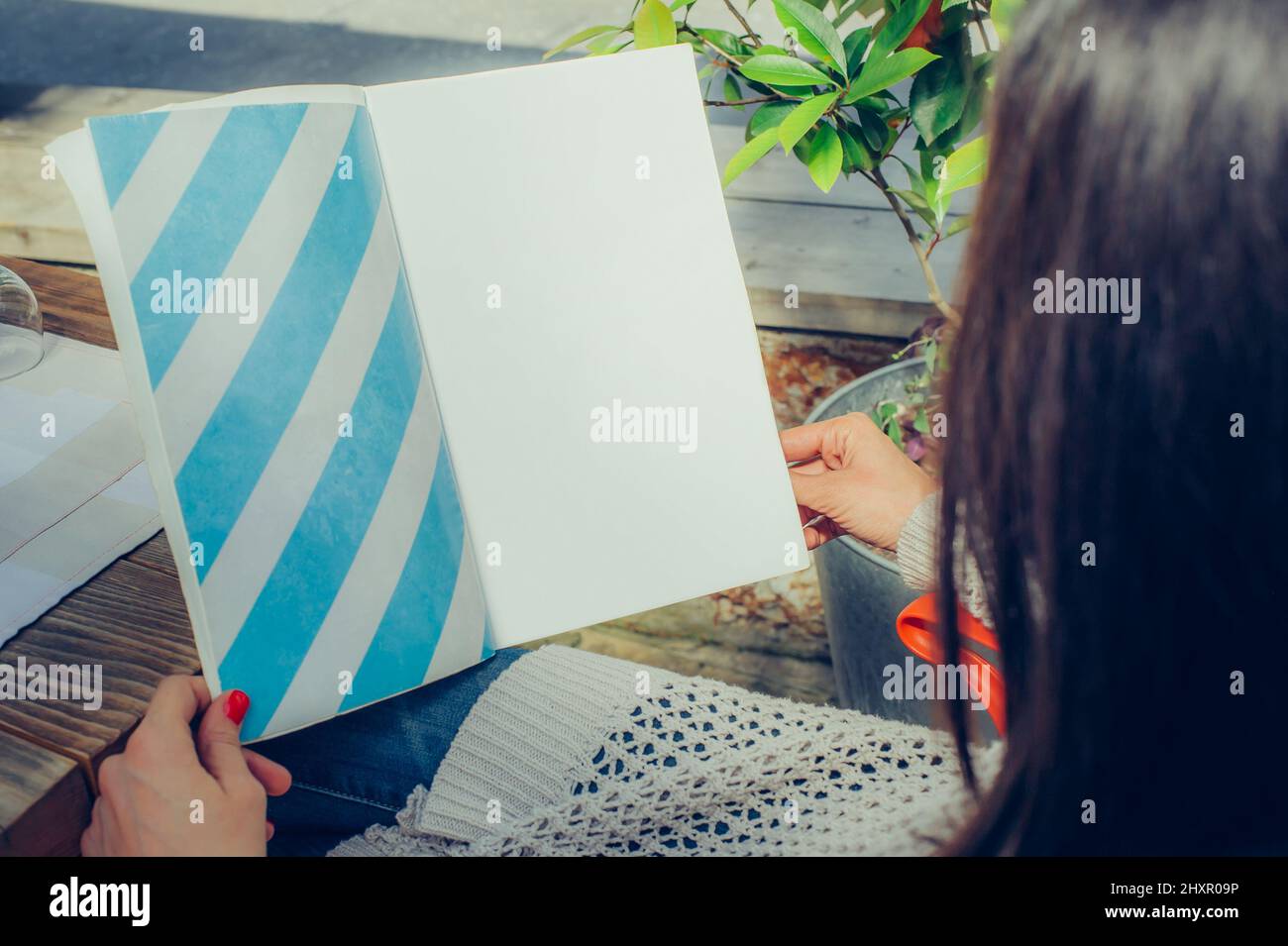 Beautiful woman looking at menu and ordering foods in restaurant. Close ...