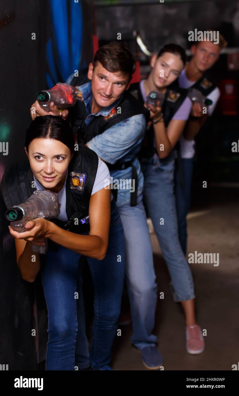 Group portrait of people playing laser tag game Stock Photo - Alamy