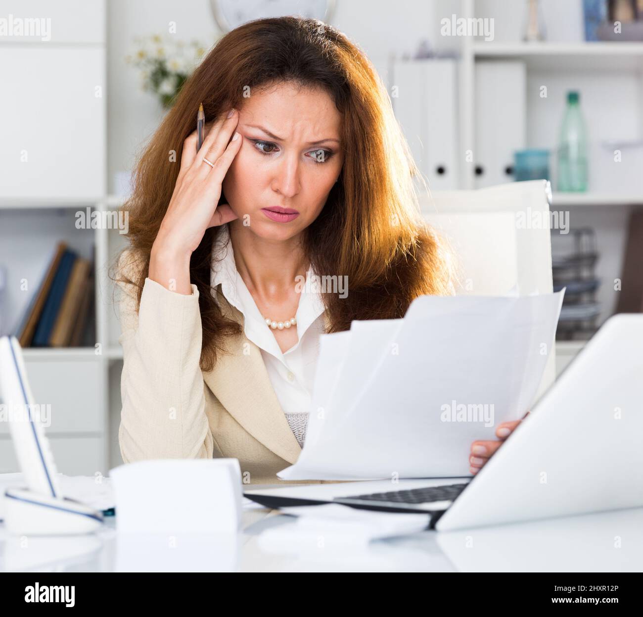 Woman is having complicated issue with project Stock Photo - Alamy