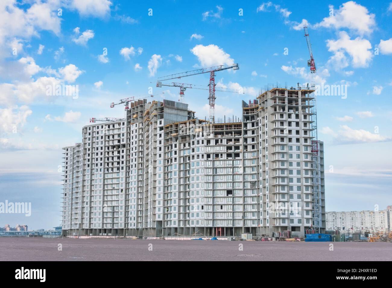 Construction site, cranes and multi-storey unfinished buildings Stock ...