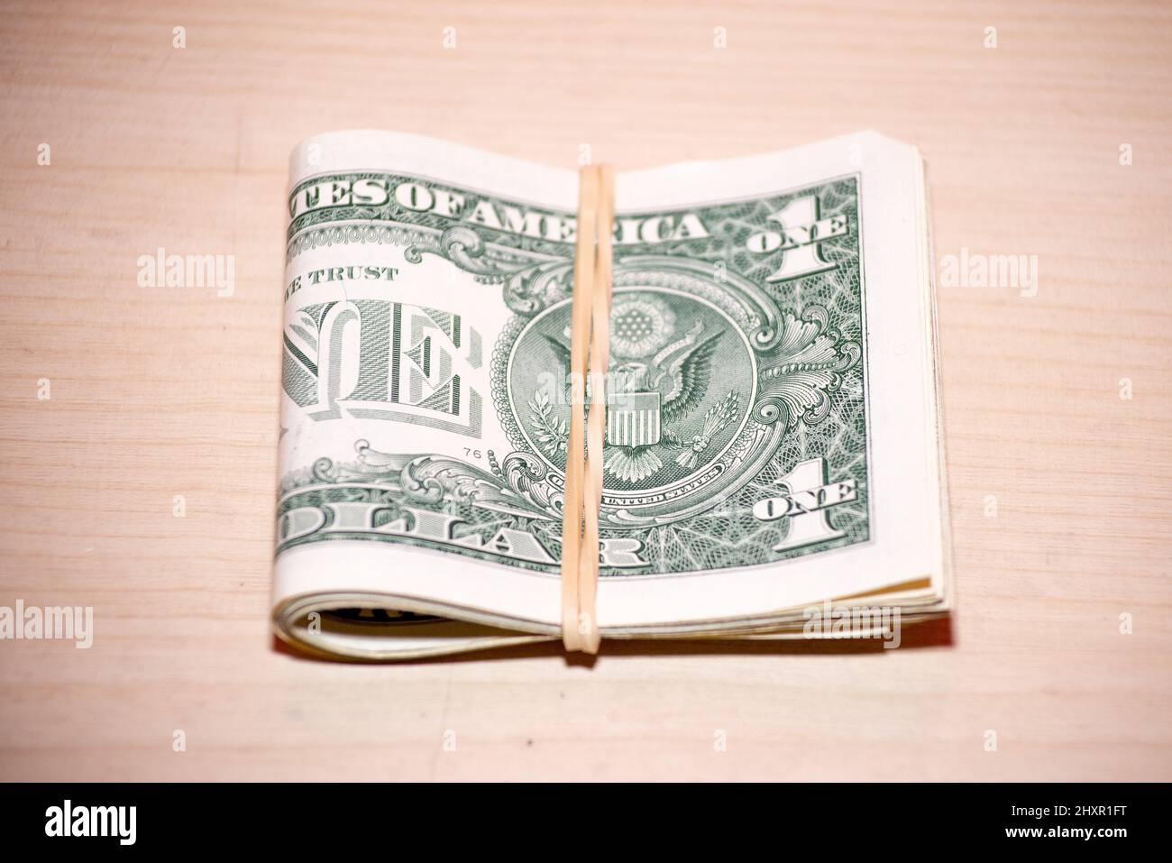 Wad of bills US banknotes folded. Cash of dollar bills Stock Photo - Alamy