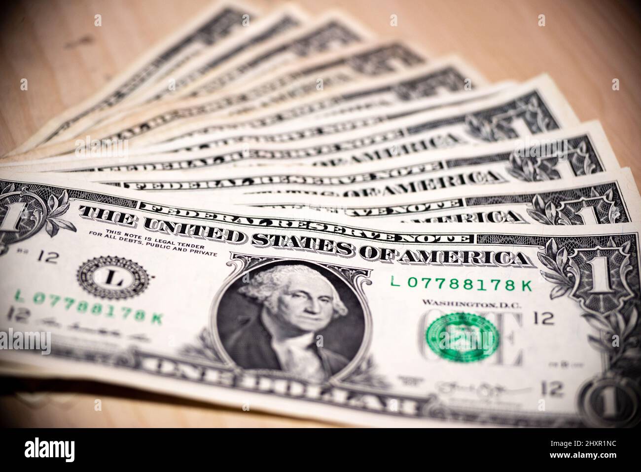 Group of one bill dollars in a table Stock Photo - Alamy
