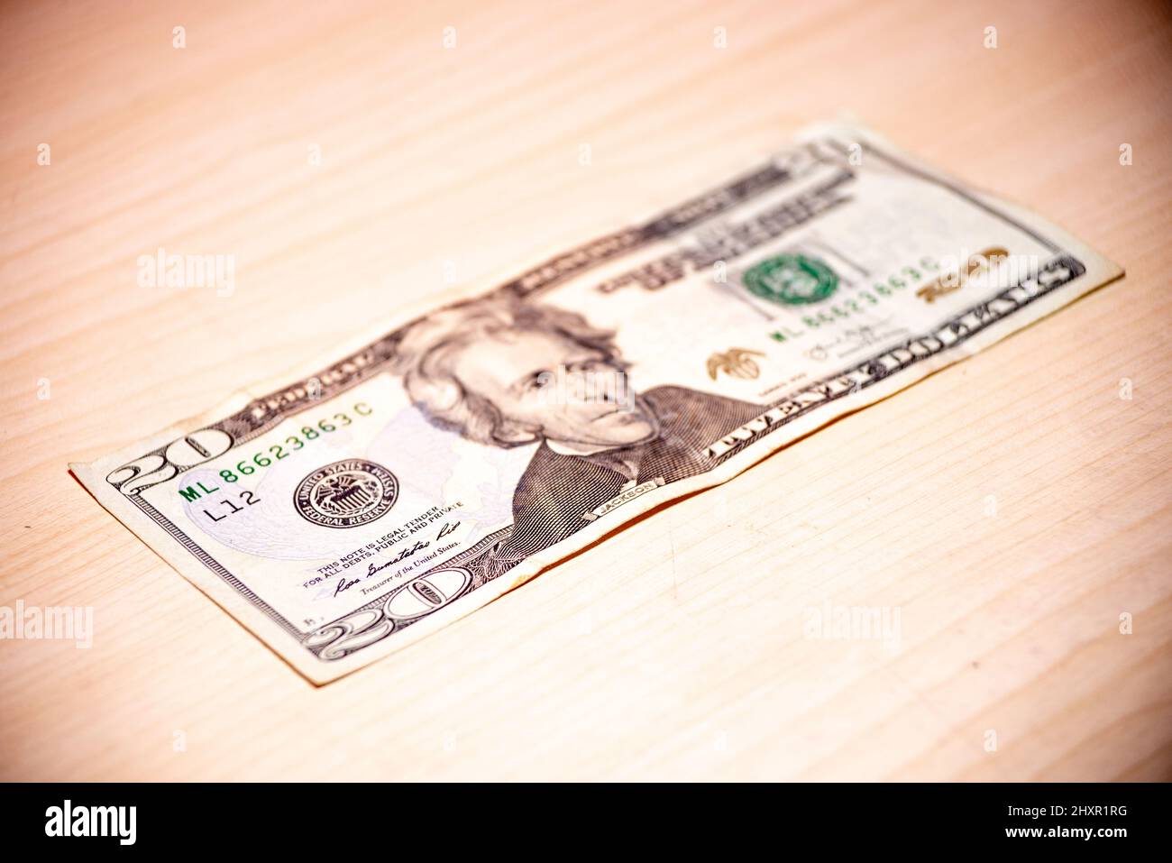 Twenty US dollar bill in a wood table. Us banknote Stock Photo - Alamy
