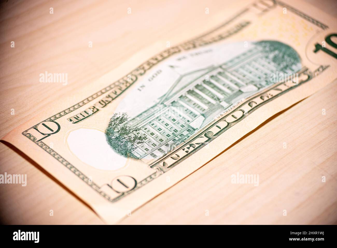 Ten US dollar bill in a wood table. Us banknote Stock Photo - Alamy