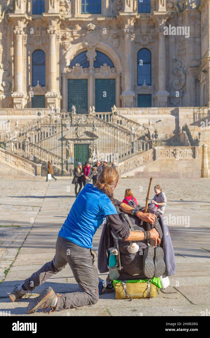 Pilgrim with his backpack in the Obradoiro square in front of the ...
