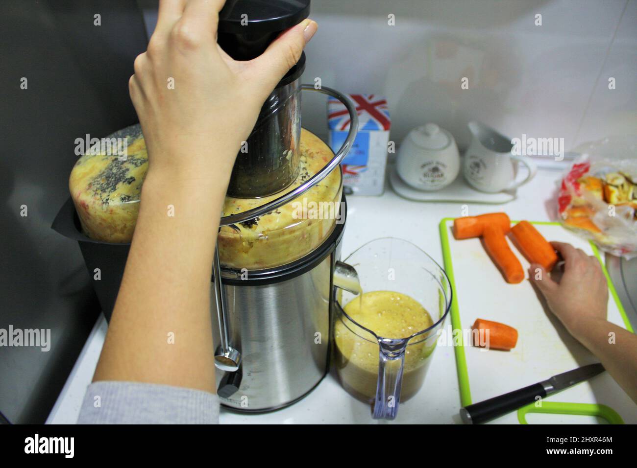 the juicer - making fresh fruit juice Stock Photo - Alamy
