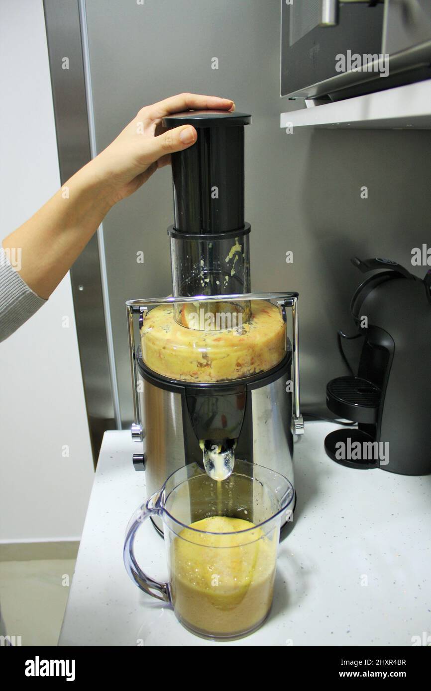 the juicer - making fresh fruit juice Stock Photo - Alamy