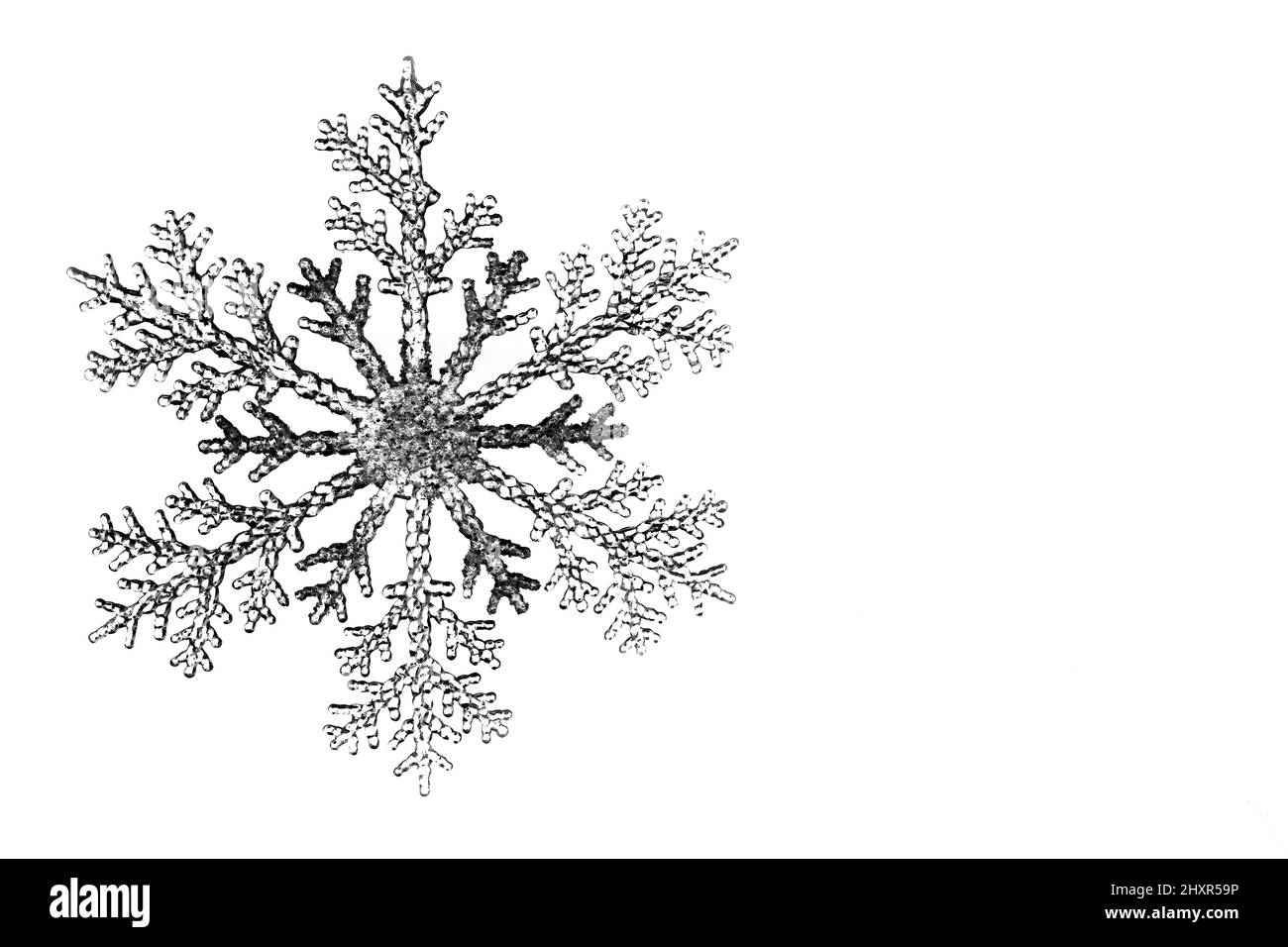 Close up of artificial snowflake on white background Stock Photo - Alamy