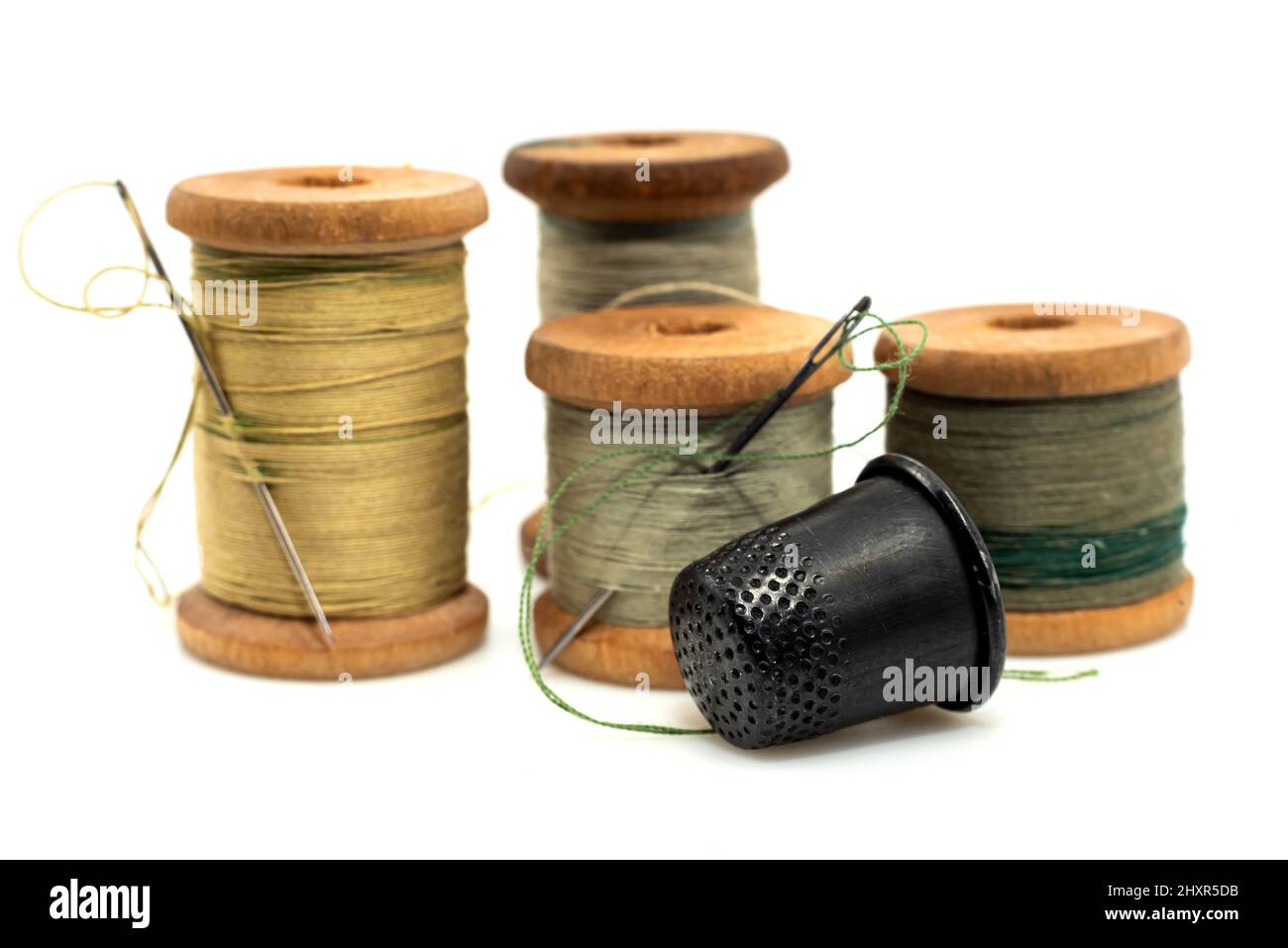 Vintage retro spool of thread on a white background. Needle with thread ...