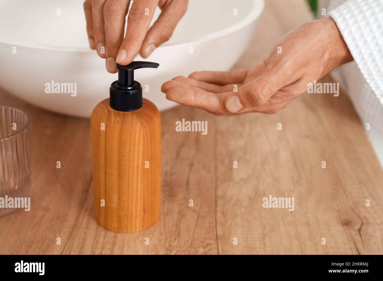Young man washing hands in bathroom, closeup Stock Photo - Alamy