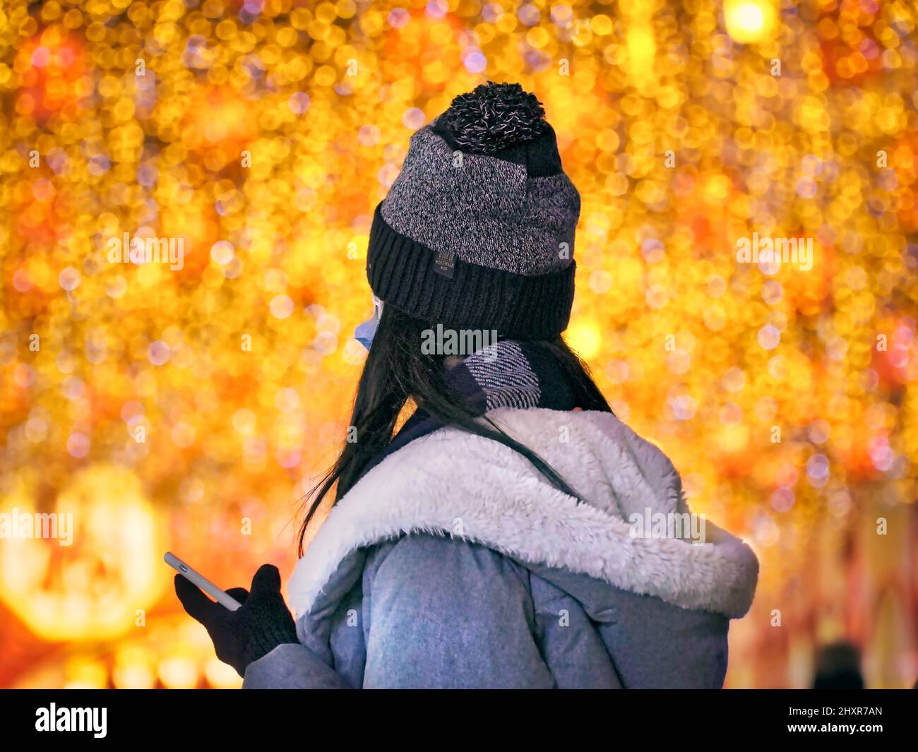 girl in front of light decoration Stock Photo - Alamy