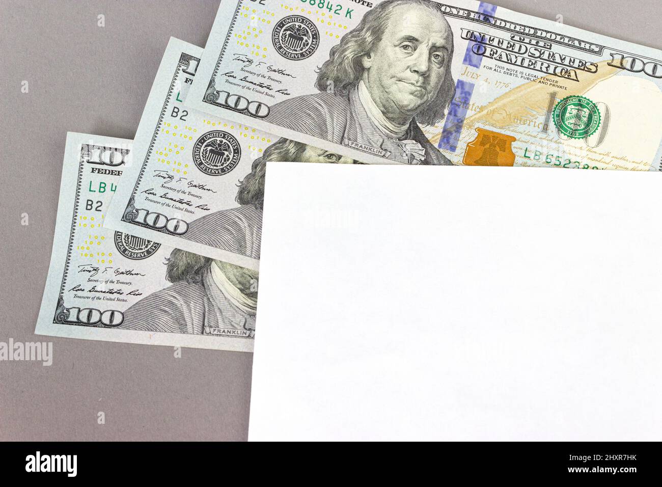 White empty paper sheet on US Currency One Hundred Dollar Bills. Mock ...