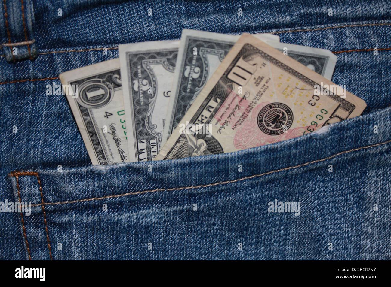 Dollars in my pocket Stock Photo - Alamy