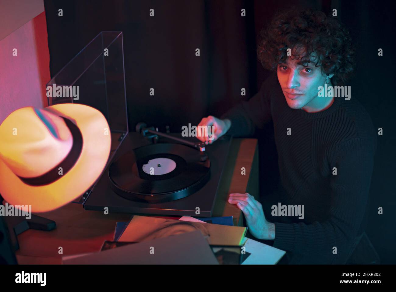 Guy listens to a vinyl record Stock Photo - Alamy
