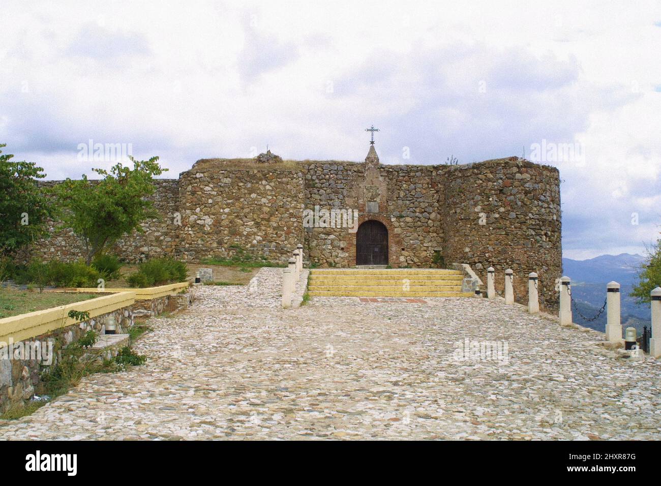 Castillo de Benadalid - A vertical shot of a house with white exterior ...
