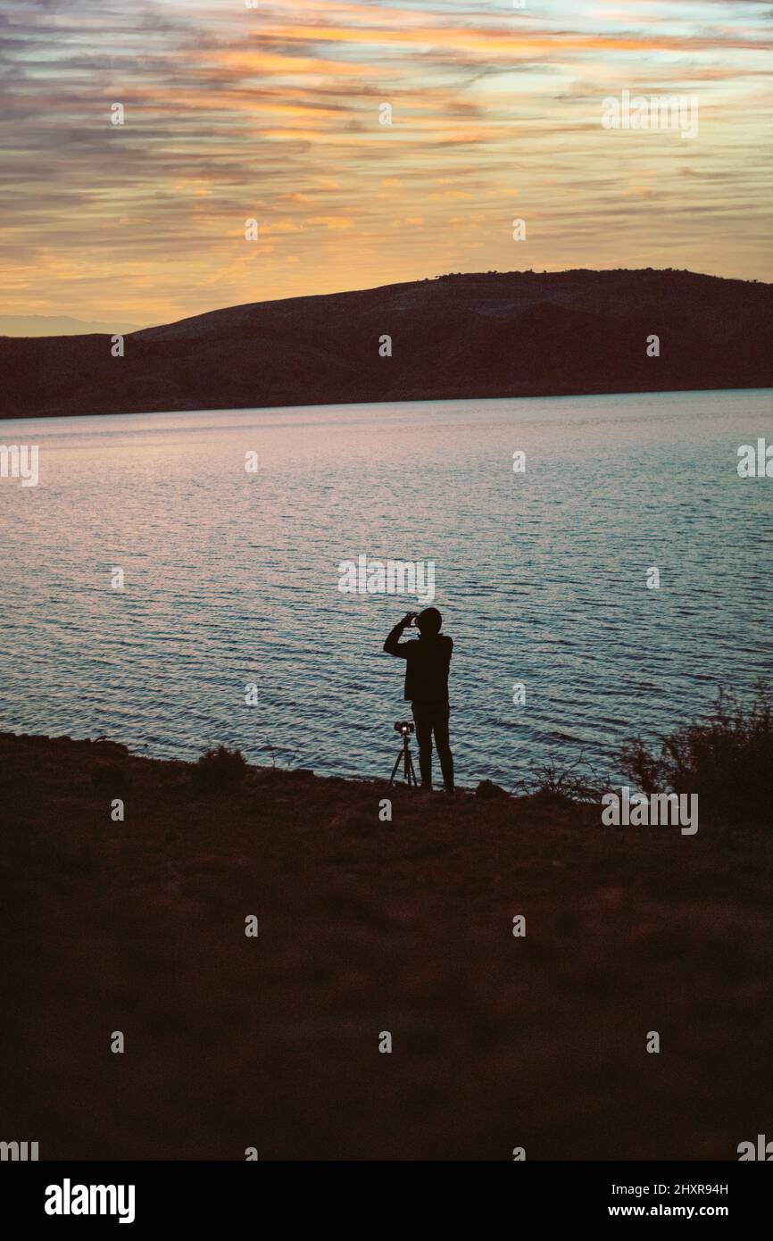Back view of a male with lake in the background Stock Photo - Alamy
