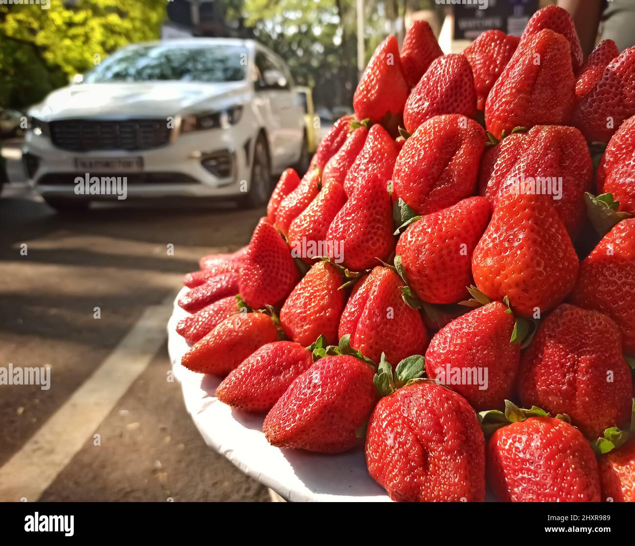 Selective focus Picture of Strawberries sold on Street in India with a ...