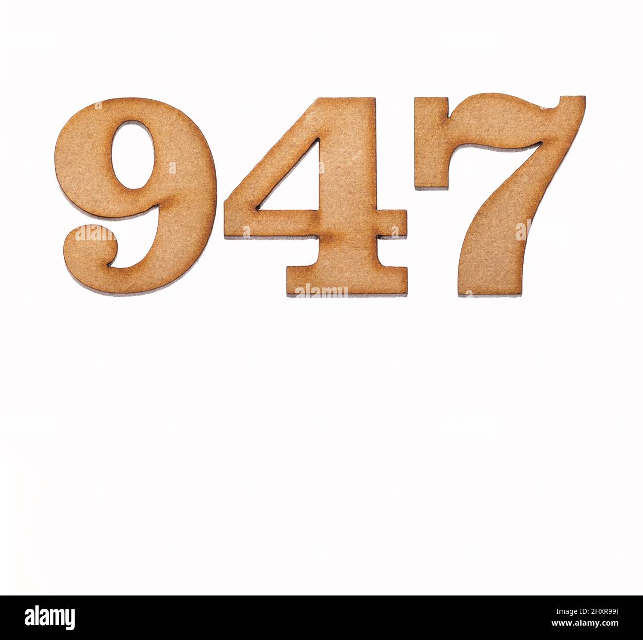 Number 947 in wood, isolated on white background Stock Photo - Alamy