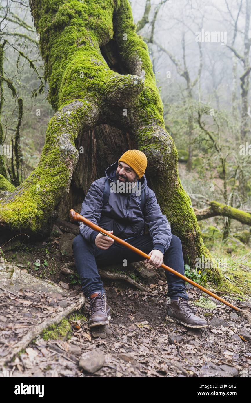 Vertical shot of the young male hiker relaxing in the forest Stock ...