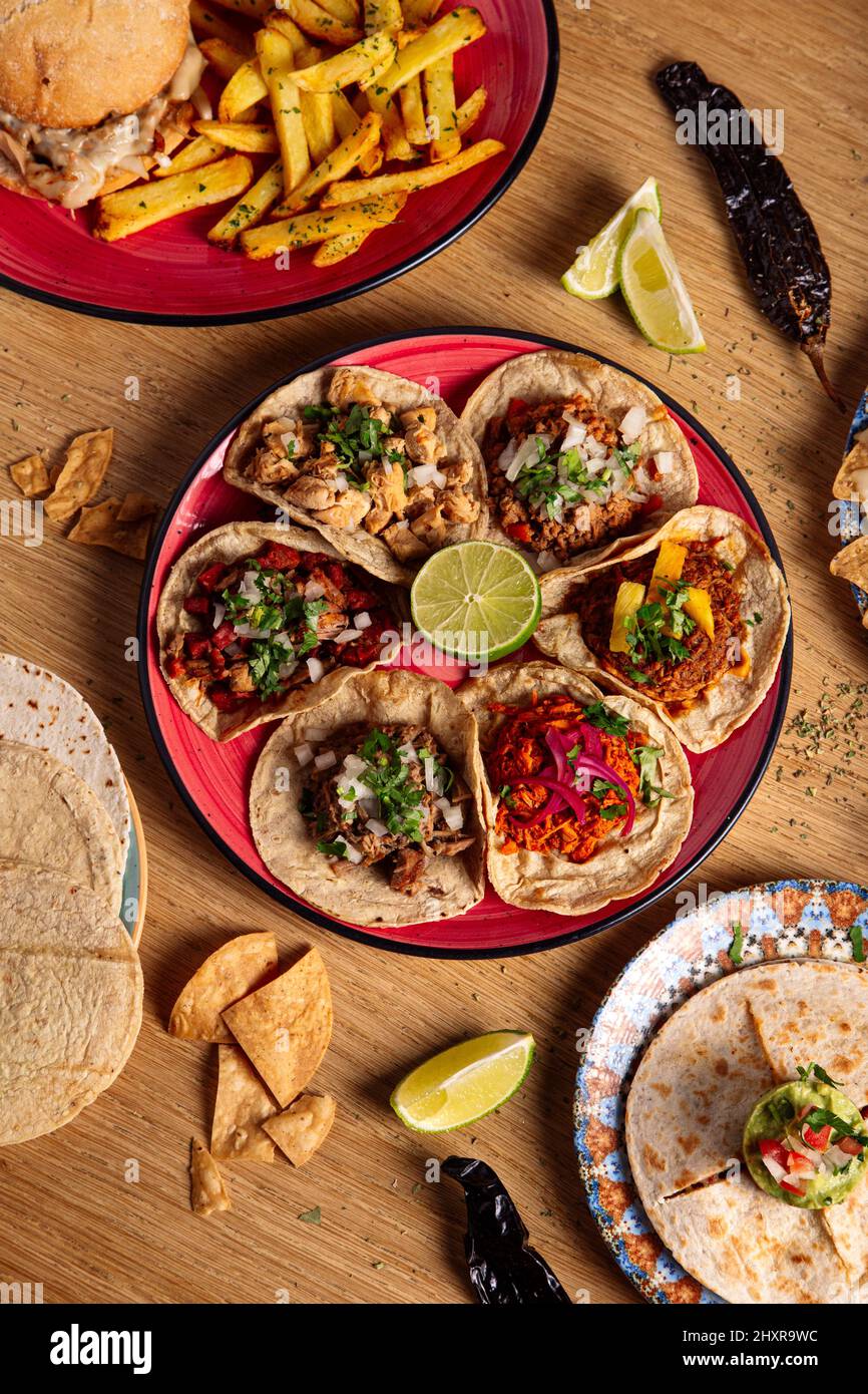Variety of typical tacos of Mexican cuisine. Top view Stock Photo - Alamy