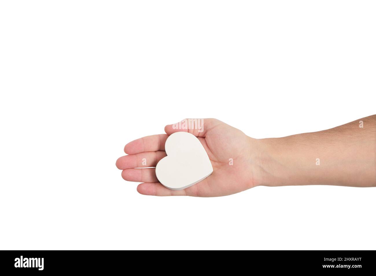 White heart in a mans hand on a white background Stock Photo - Alamy