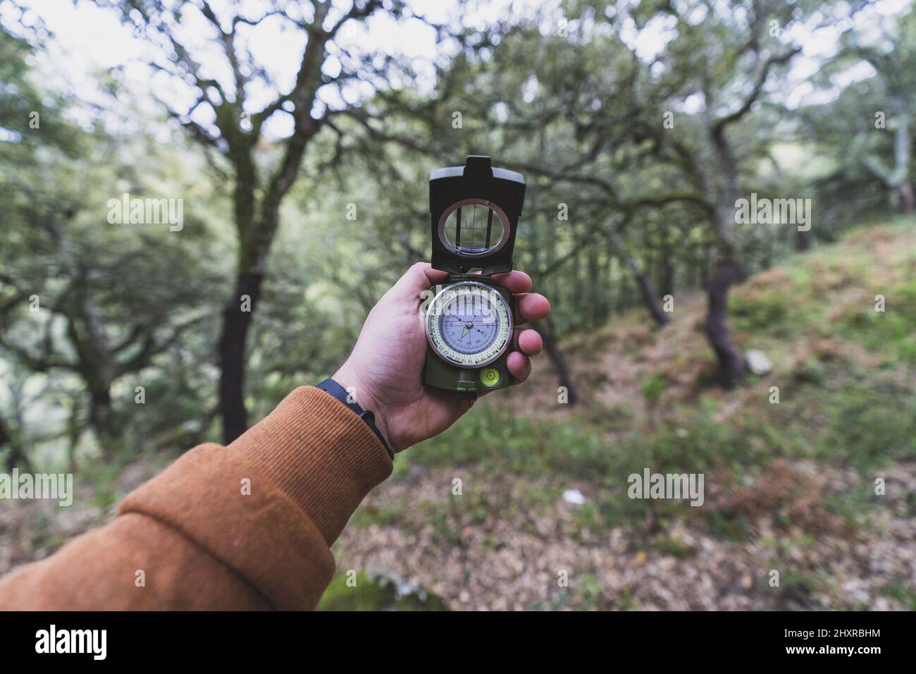 Male holding compass hiking hi-res stock photography and images - Alamy