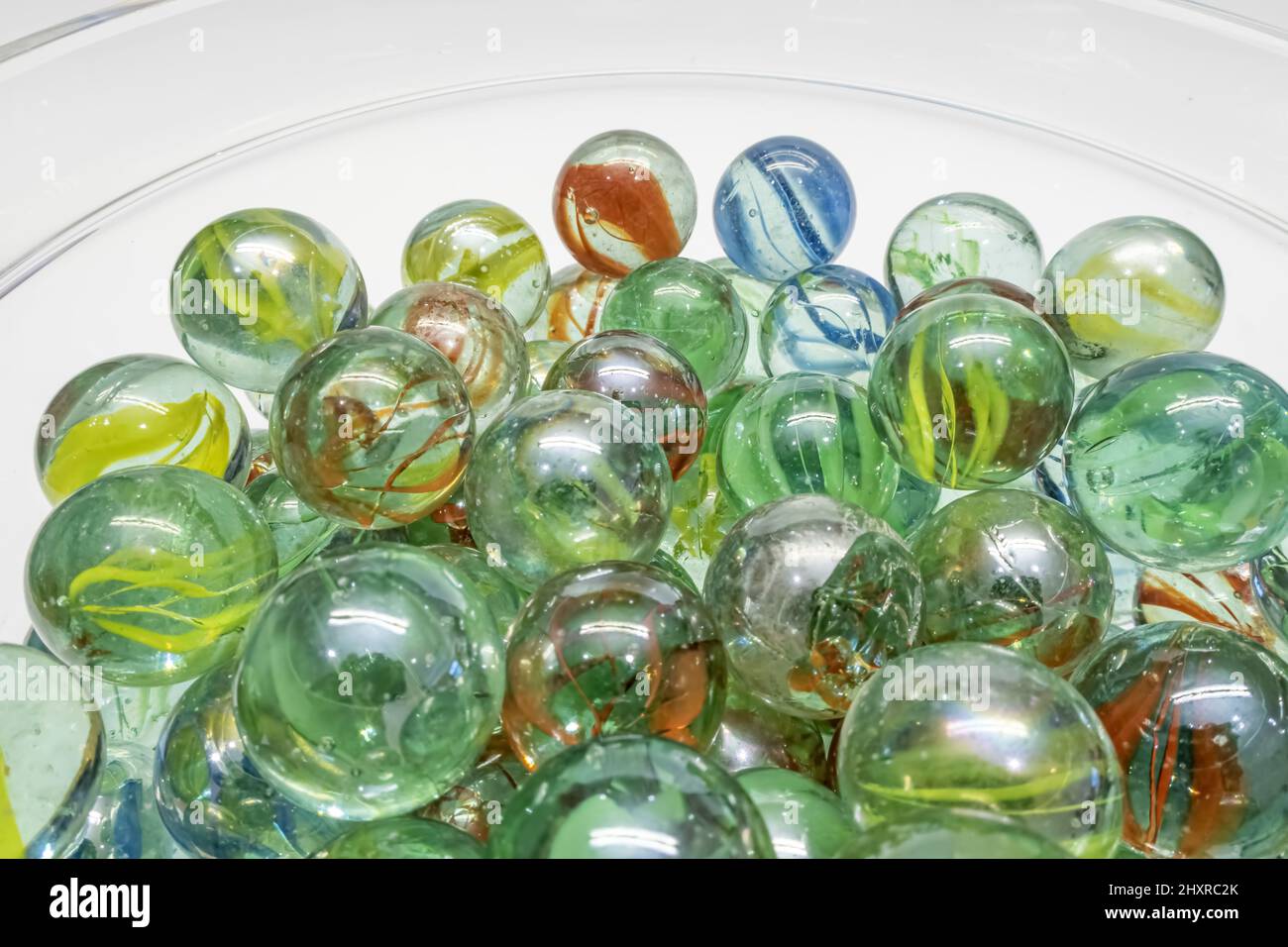 Closeup of colored glass marble balls in the petri dish Stock Photo - Alamy