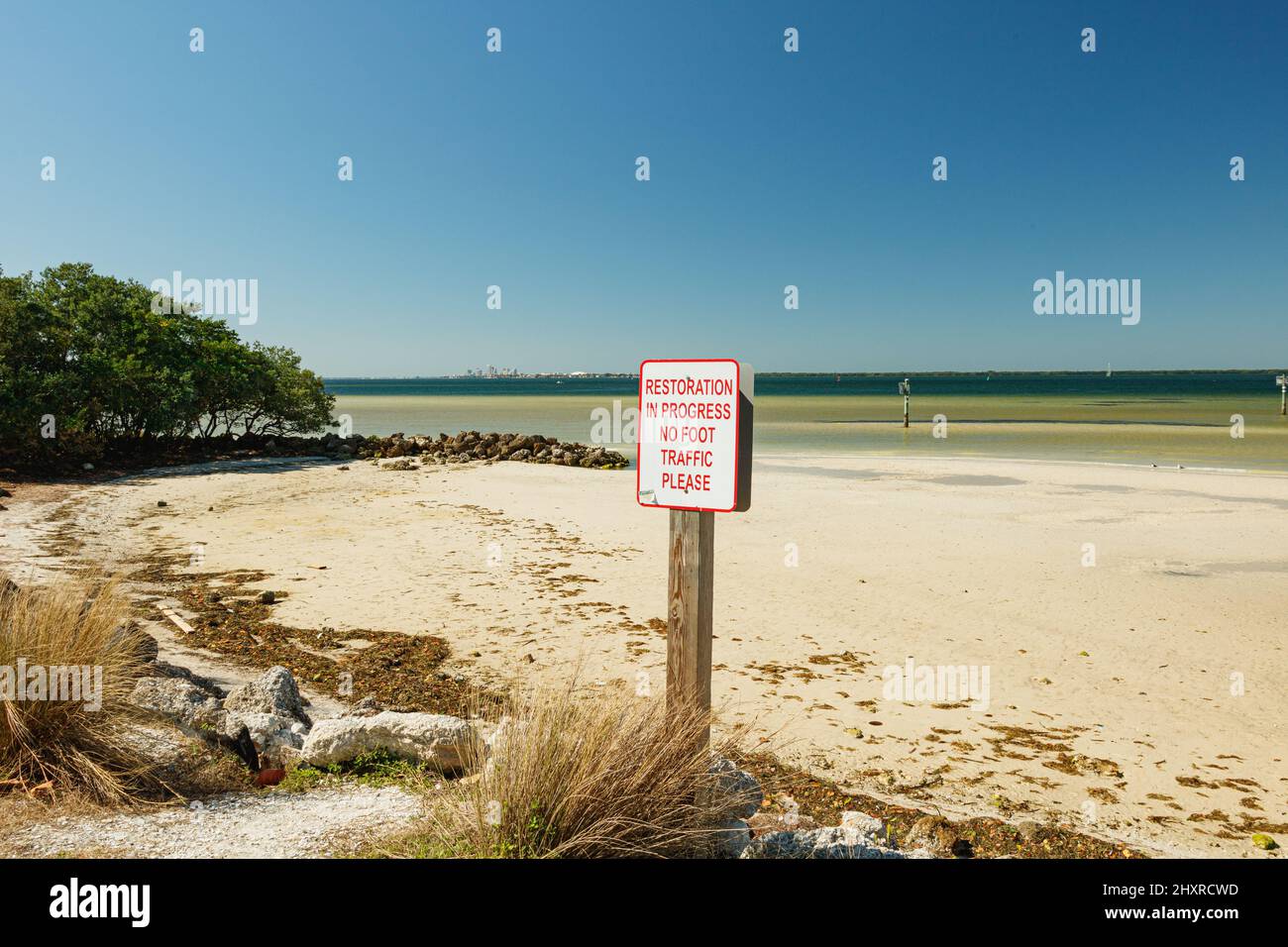 Sign on the shore saying restoration in progress no foot traffic ...
