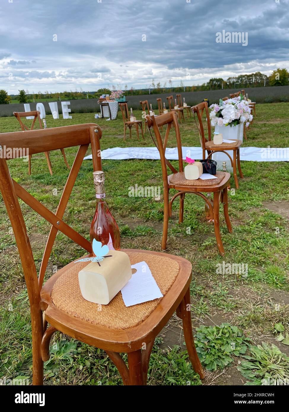 Vertical shot of the wooden chairs with cognac and other decorative ...