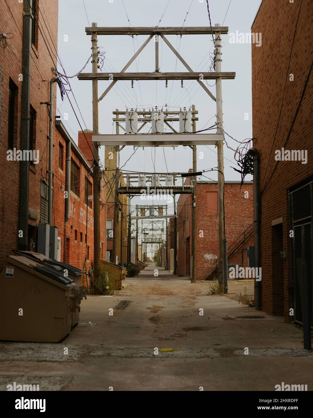 Route with electrical substations surrounded by buildings Stock Photo ...
