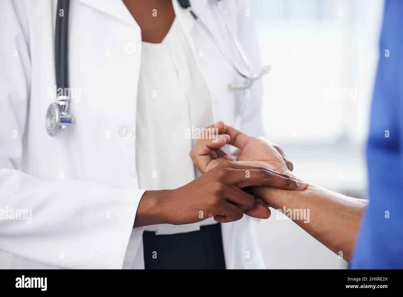 African doctor patient touch hi-res stock photography and images - Alamy