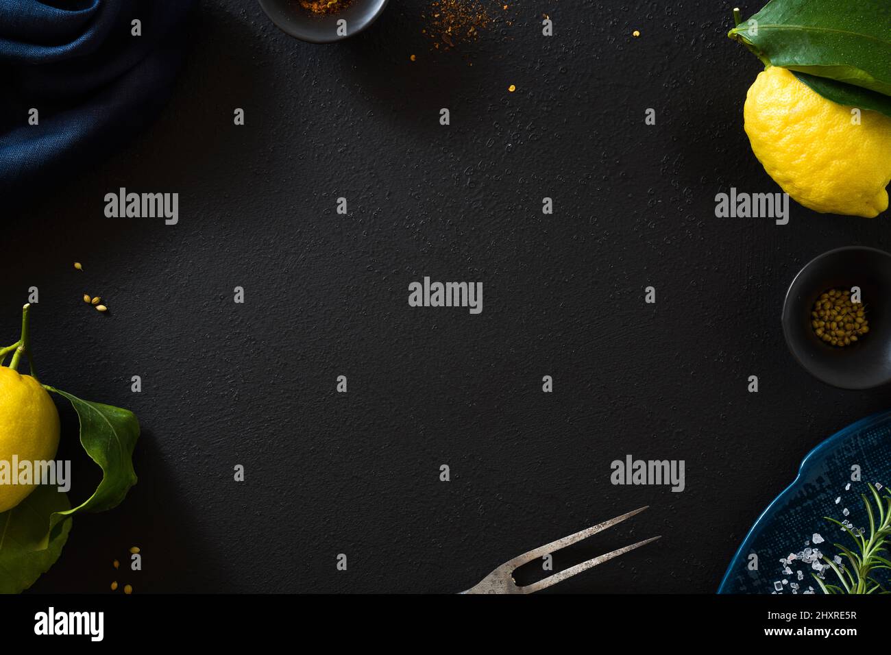 empty black food background with lemons for writing text or advertising ...