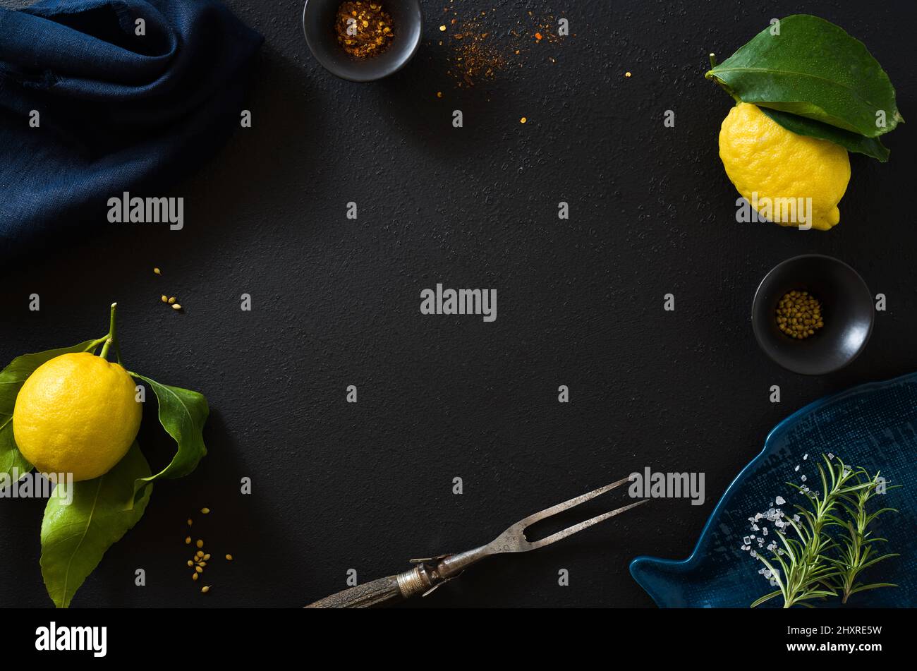 empty black food background with lemons for writing text or advertising ...