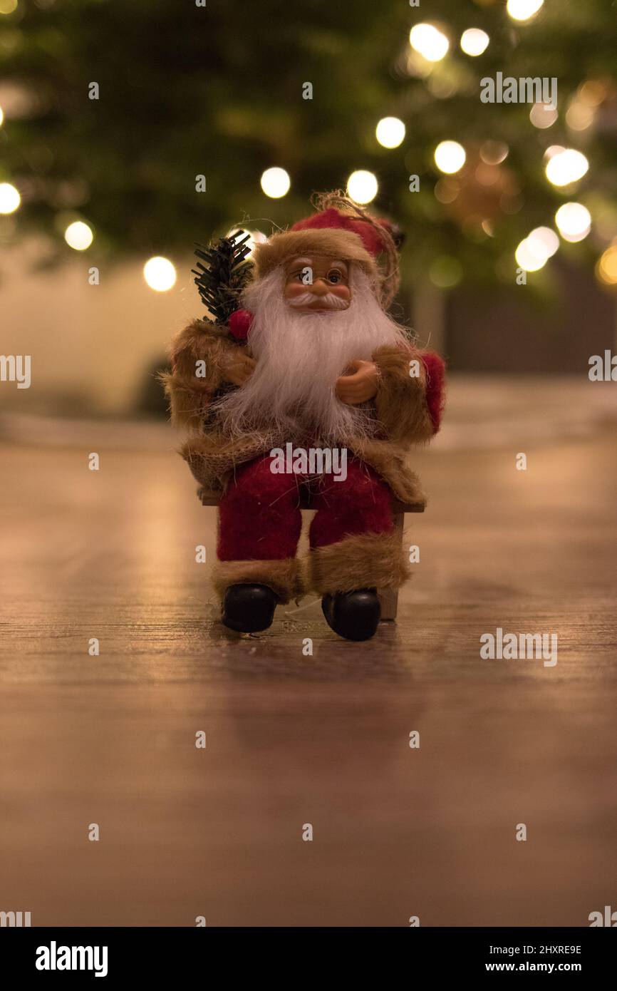 Santa Claus figure sitting on a chair Stock Photo - Alamy