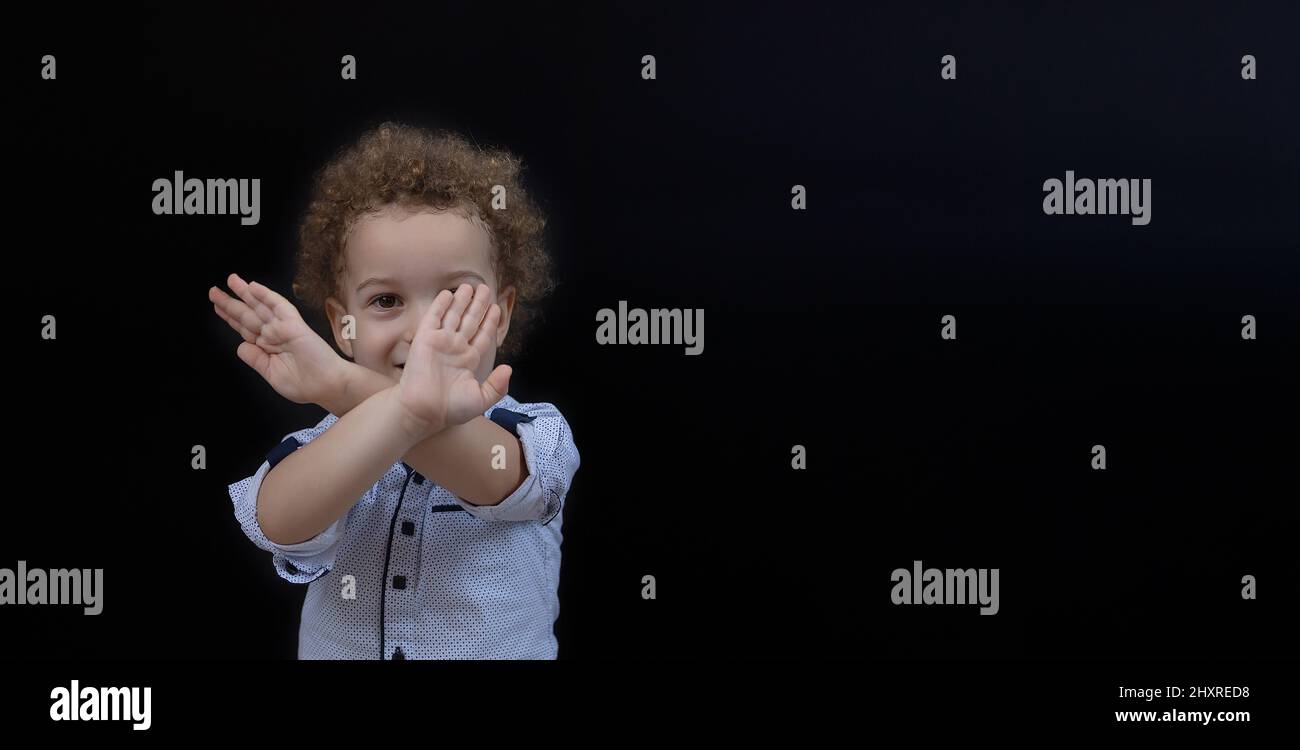 boy stands in a defense pose with arms crossed in front Stock Photo - Alamy