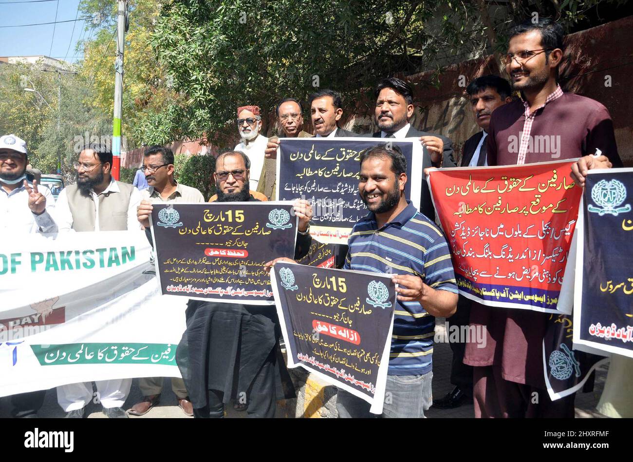 Members of Consumer Association of Pakistan (CAP) are holding awareness ...