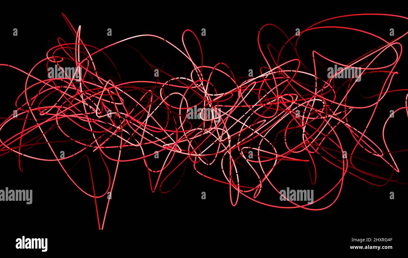 Tangled line moves on black background. Motion. Twisting tangled ...