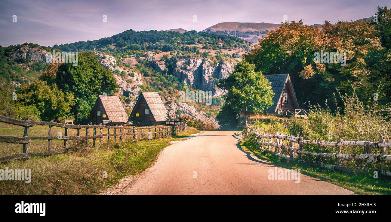 Narrow pass road winds through beautiful mountain village Stock Photo ...