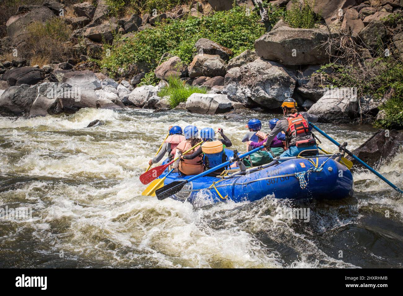A raft rides into big whitewater Stock Photo - Alamy